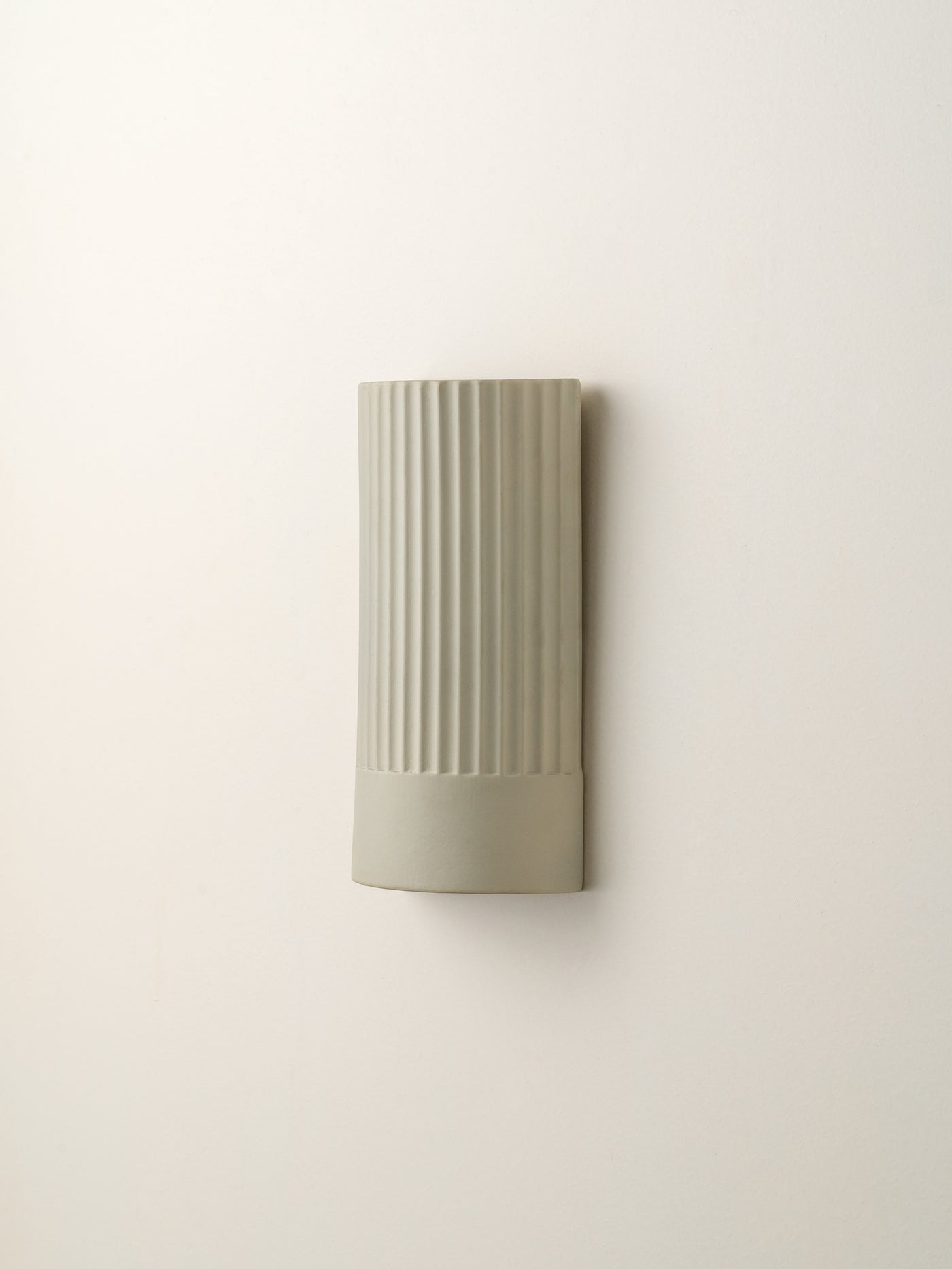 Enza - warm white ribbed ceramic wall light