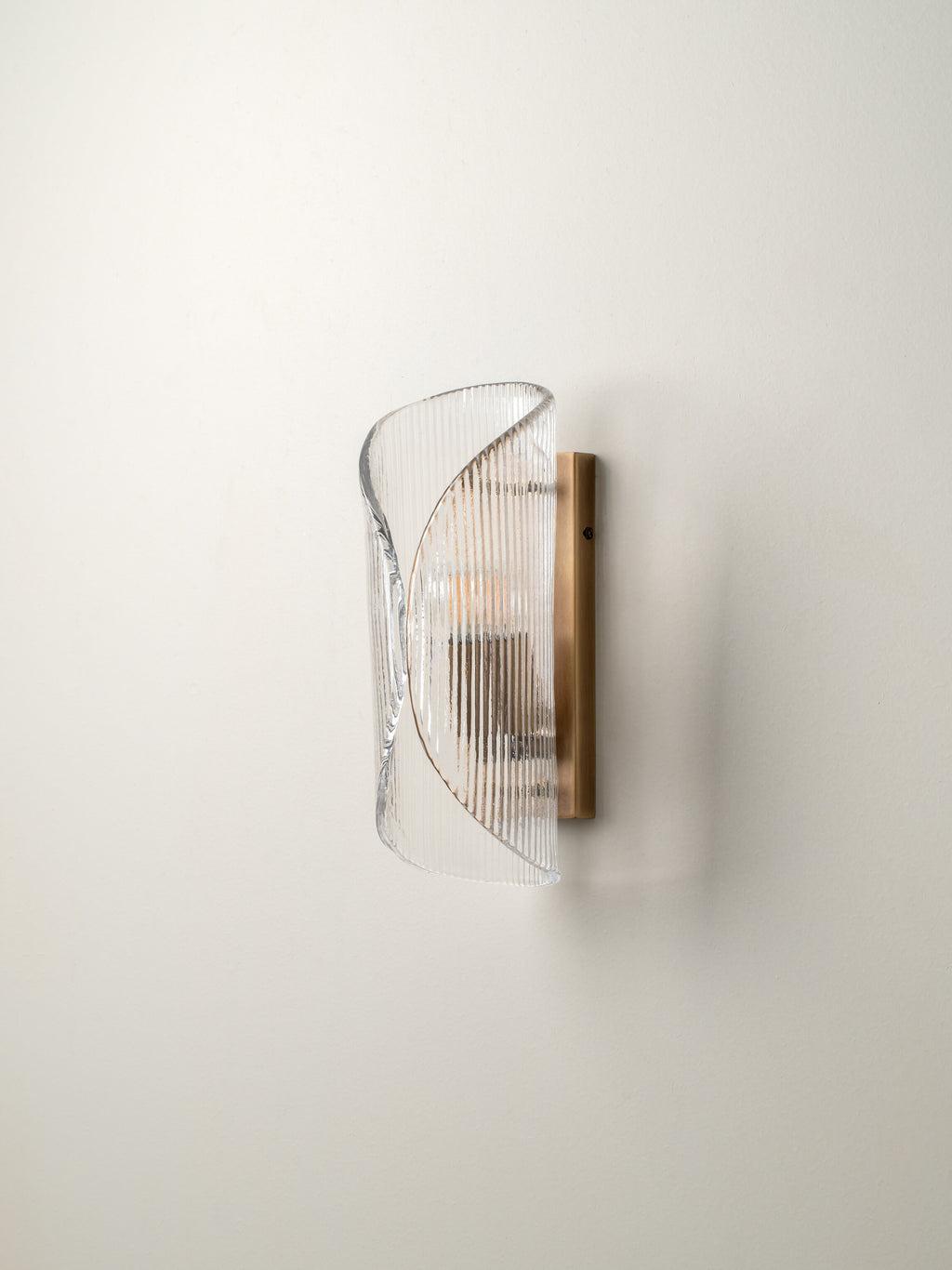 Cannoli - aged brass and textured glass wall light