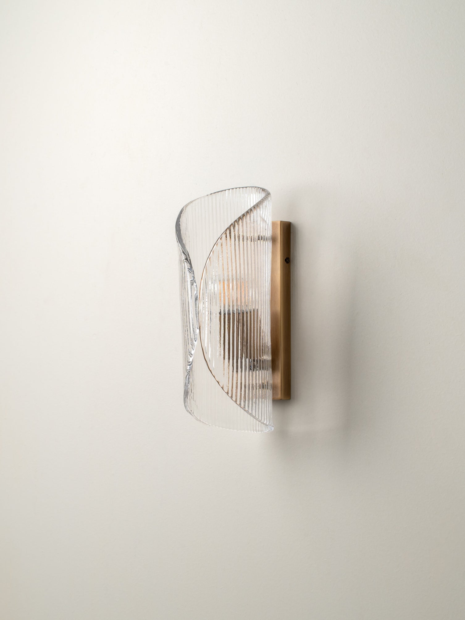 Cannoli - aged brass and textured glass wall light