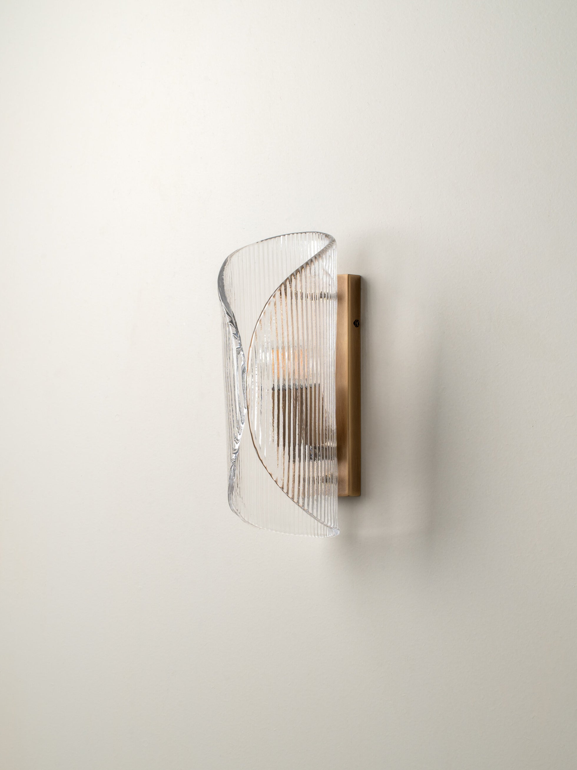 Cannoli - aged brass and textured glass wall light