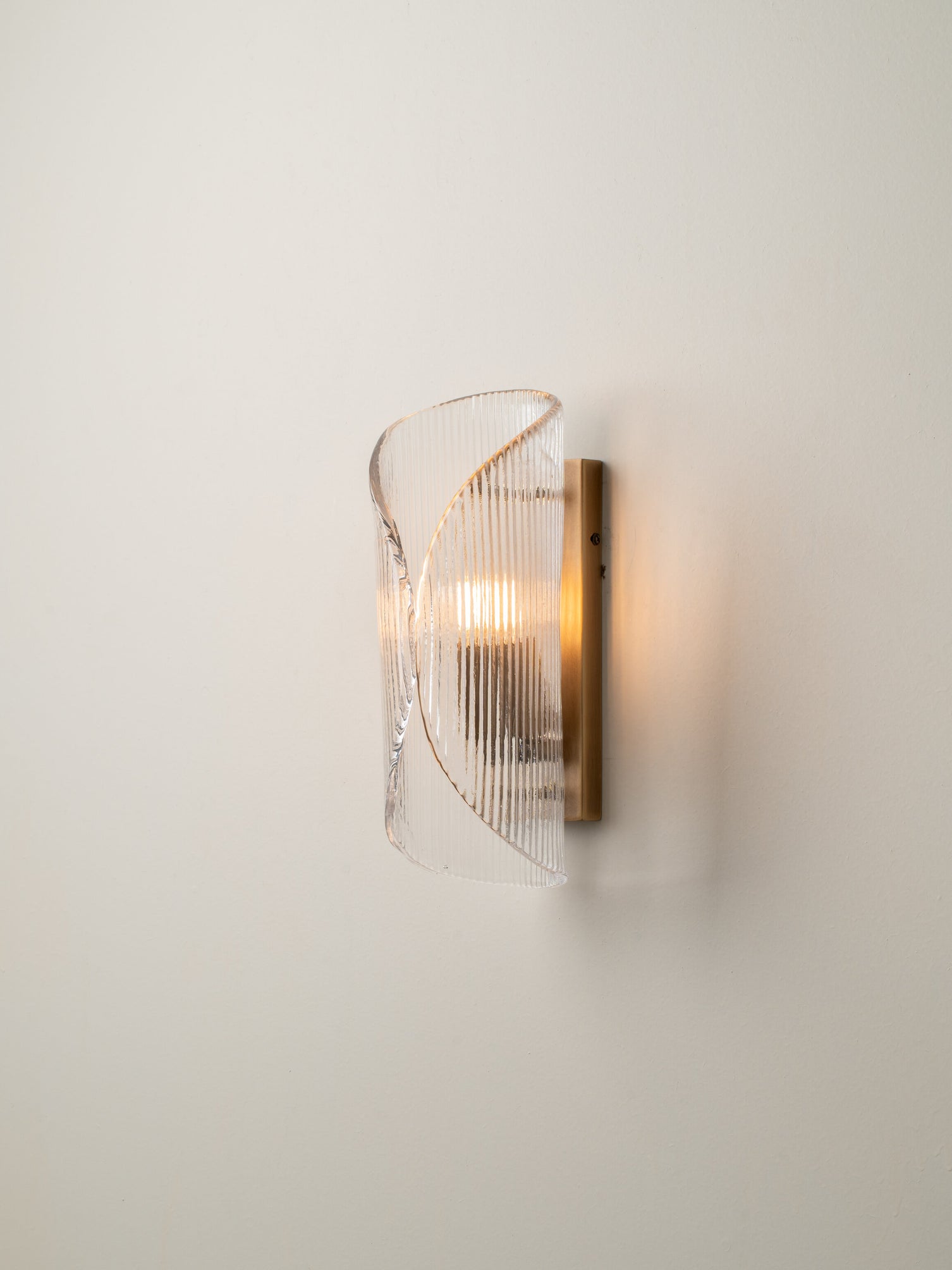 Cannoli - aged brass and textured glass wall light