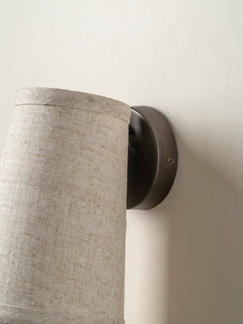 Solara - bronze and layered natural linen wall light